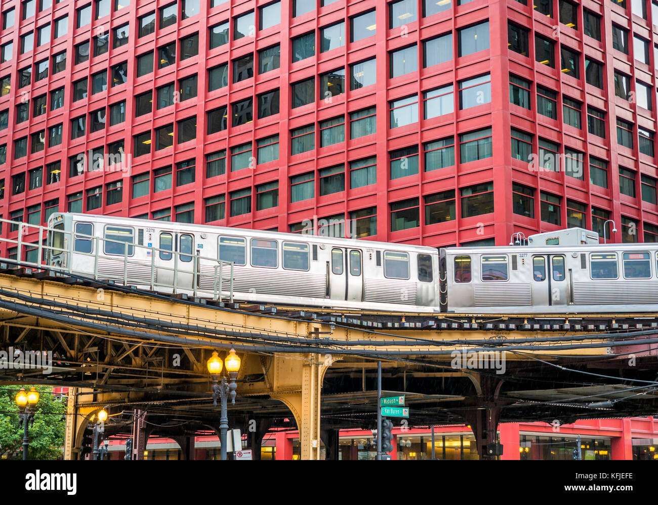 Moving Train on elevated tracks within buildings at the Loop, Glass and ...