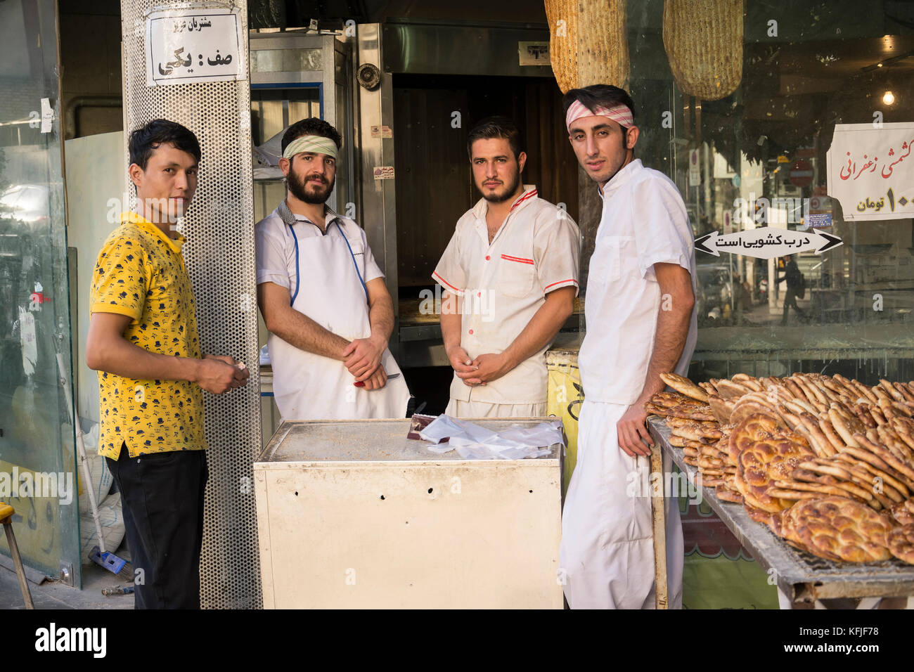 Tehran, IRAN - August 16, 2017 Group of bakery shop workers standing in ...