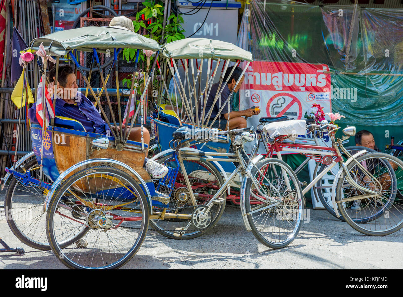 CHIANG MAI, THAILAND - JULY 29: Rickshaw drivers waiting for passengers ...