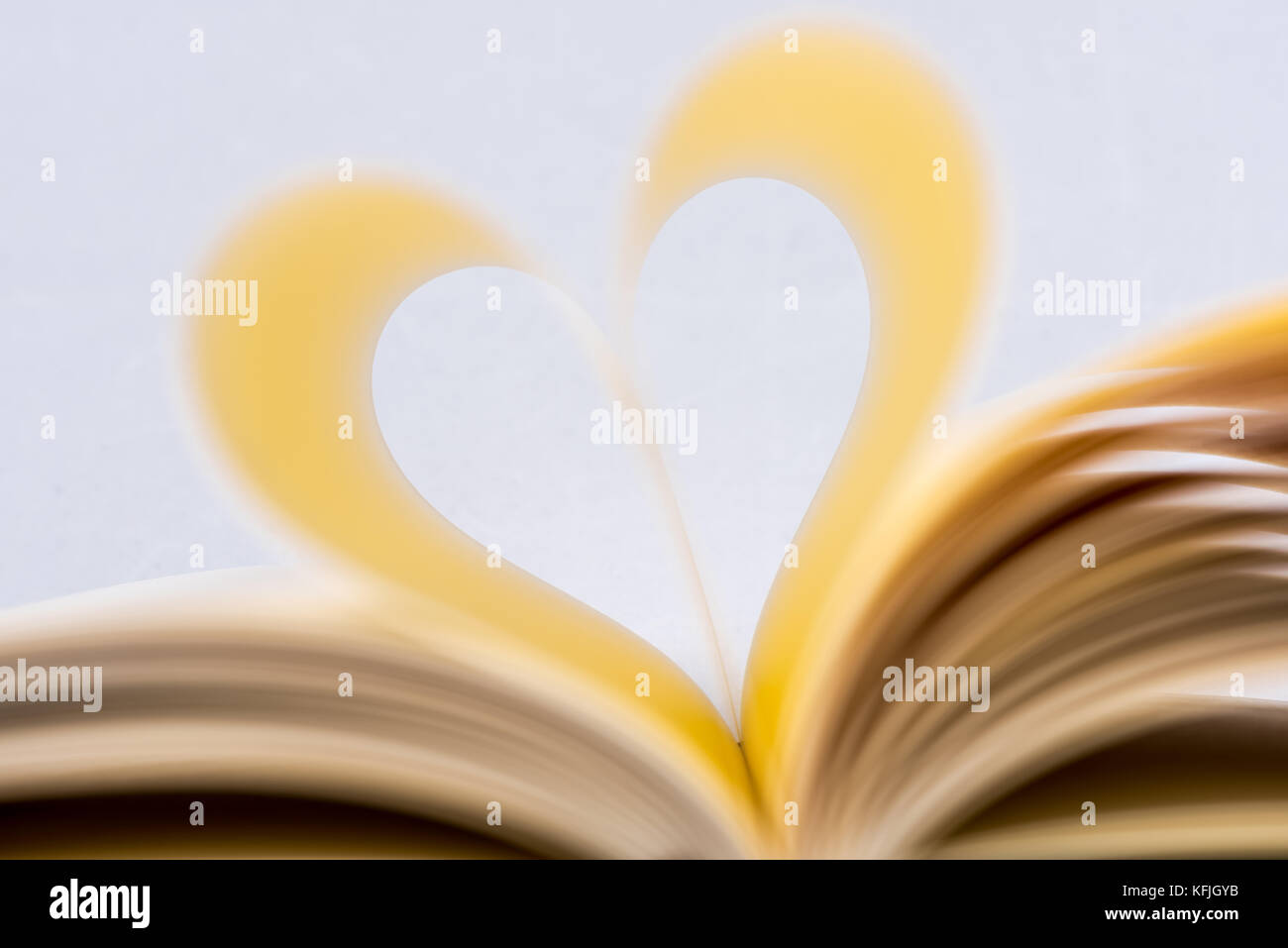 Book page in heart shape, focus on background. Heart Shaped Book Stock ...