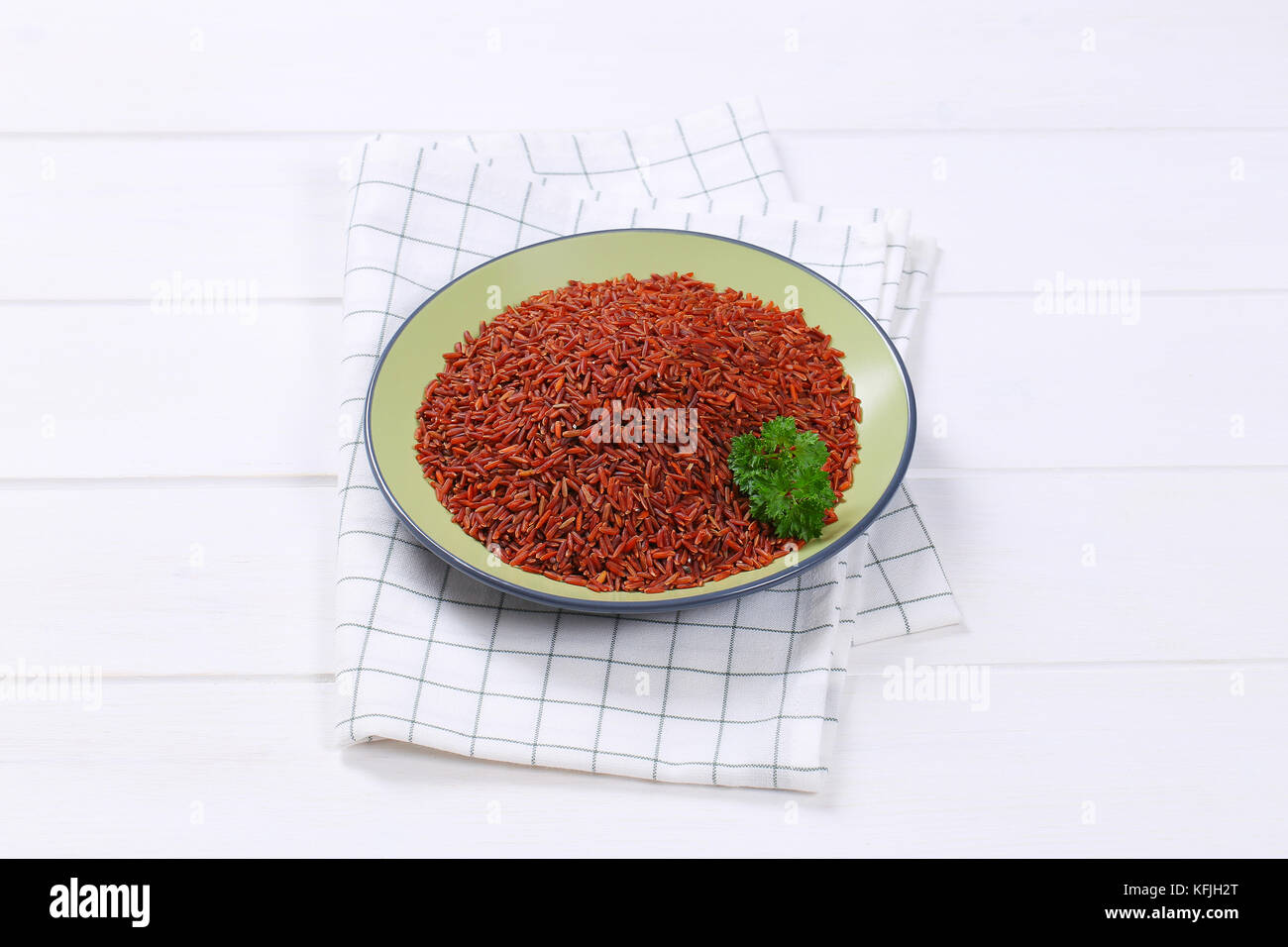 plate of red rice on checkered dishtowel Stock Photo - Alamy
