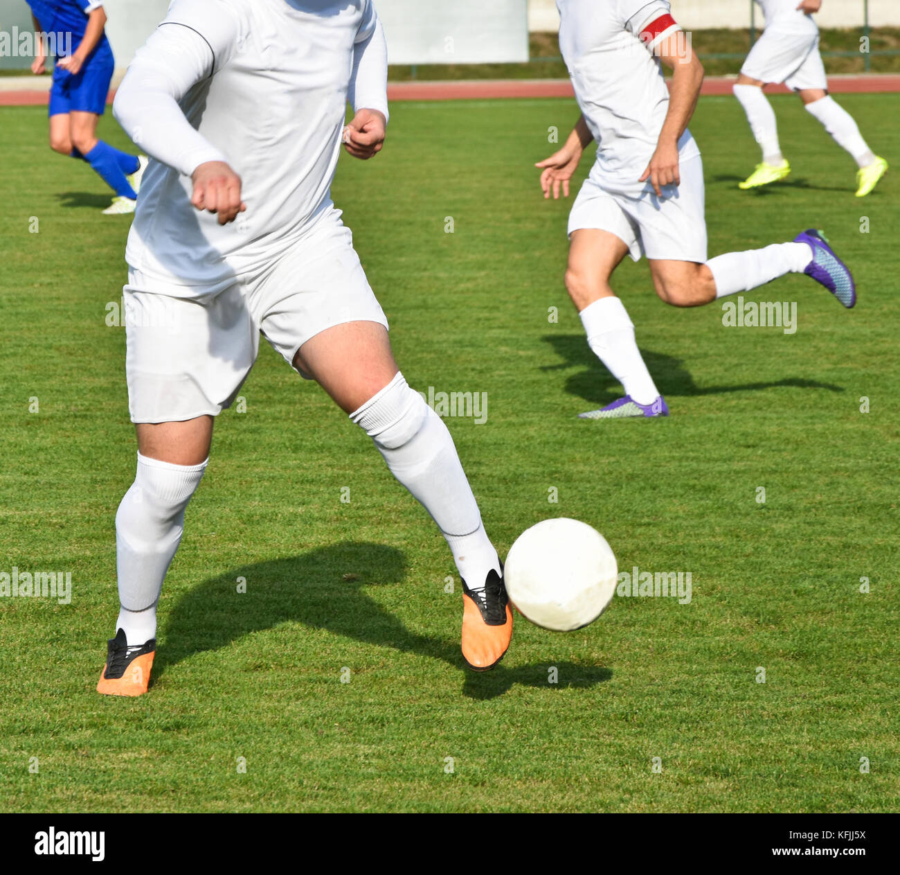 Men are playing soccer outdoor in summer Stock Photo - Alamy