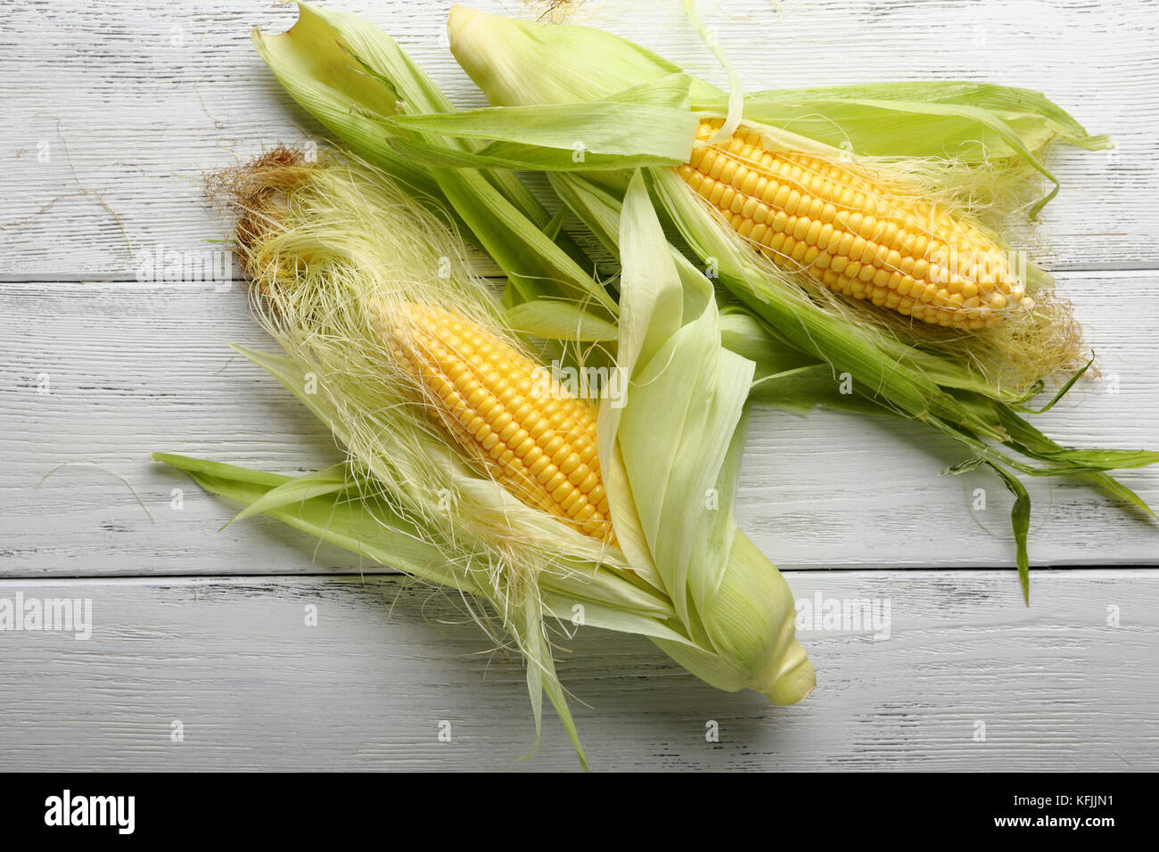 Fresh sweet corn on white boards, food top view Stock Photo - Alamy