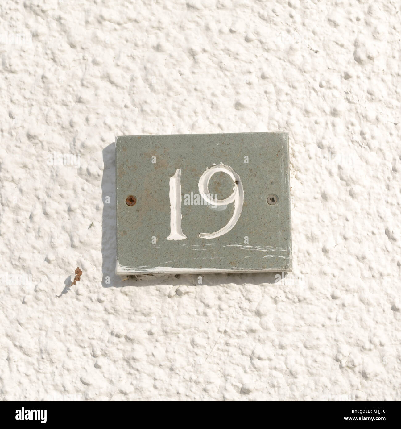 House number 19 sign on wall Stock Photo - Alamy