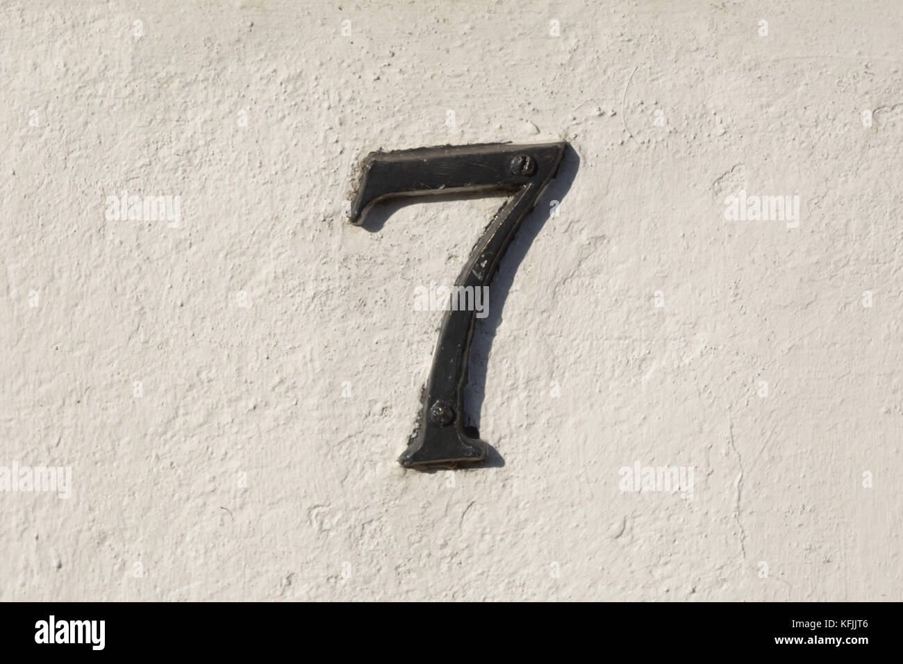 House number 7 sign on wall Stock Photo - Alamy