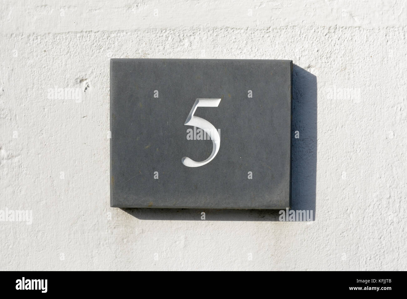 House number 5 sign on wall Stock Photo - Alamy
