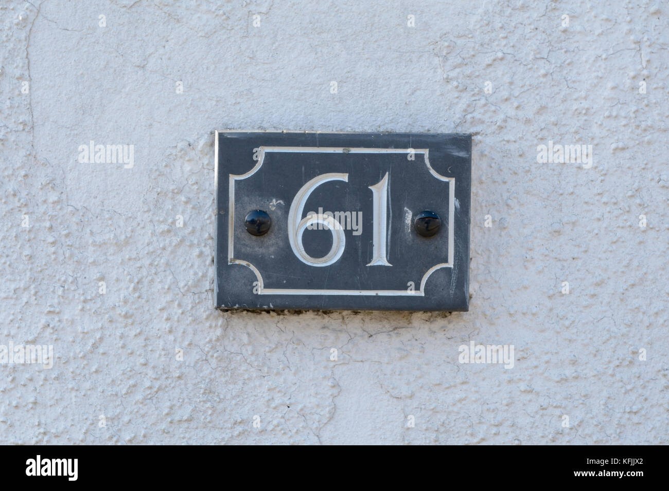 House number 61 sign on wall Stock Photo - Alamy