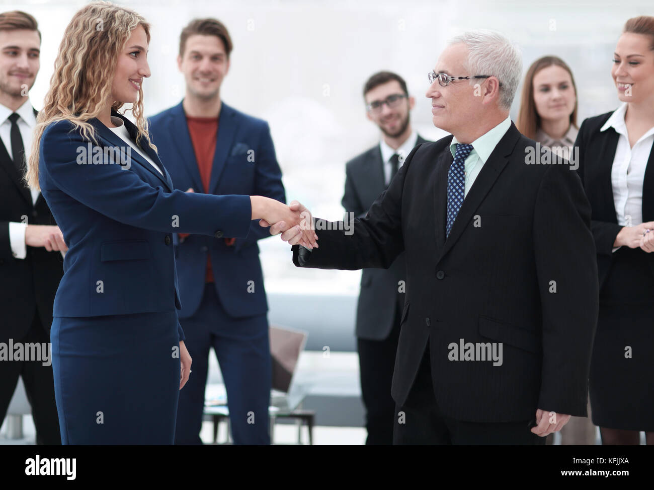 handshake serious businessman and business woman Stock Photo - Alamy