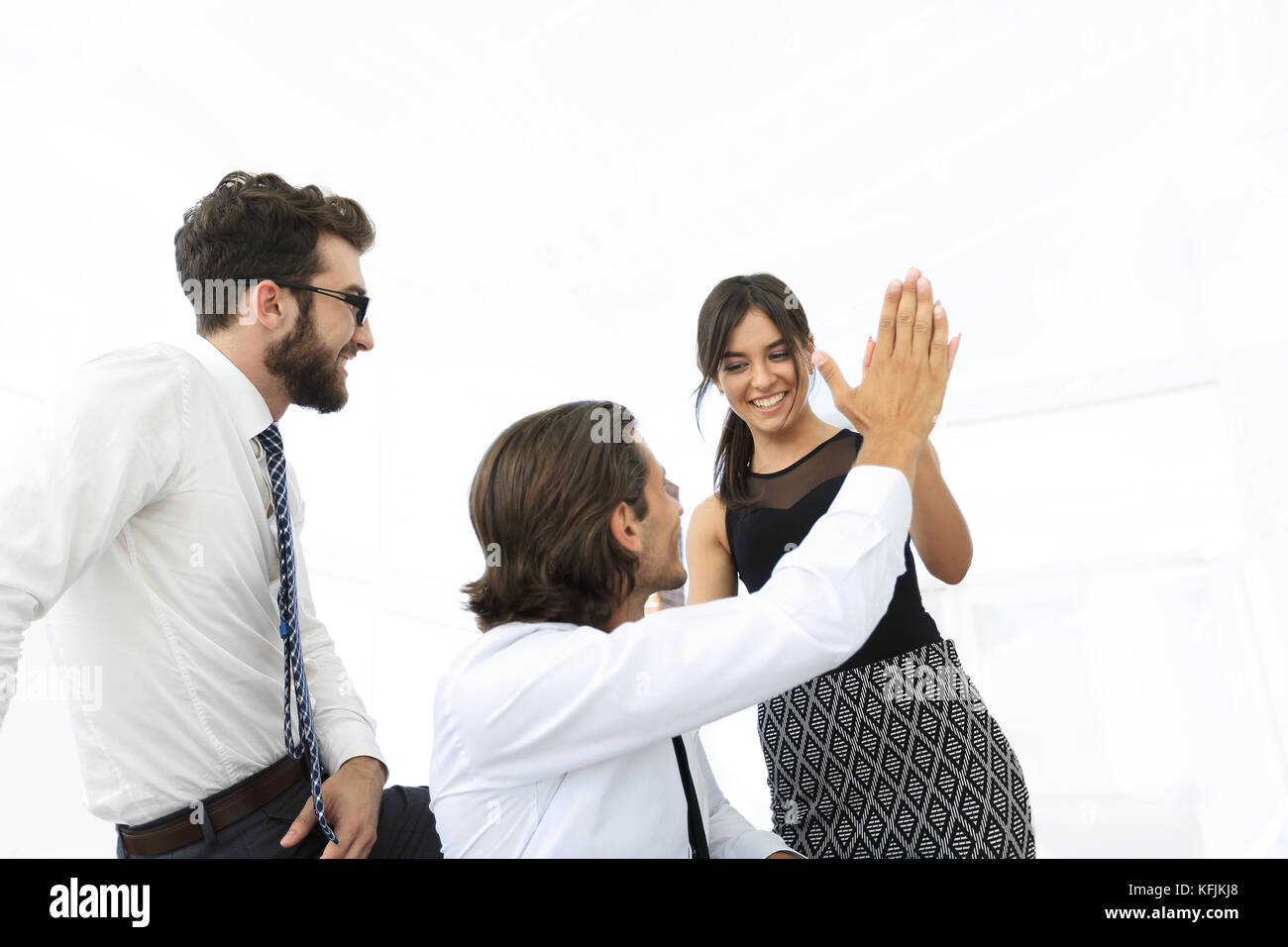 handsome man and beautiful woman giving hi five Stock Photo - Alamy