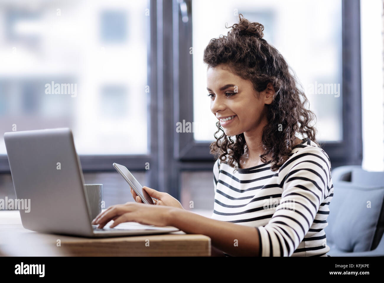 Beautiful girl working on her laptop Stock Photo - Alamy
