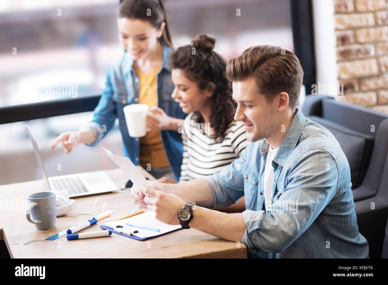 Content man holding a sheet of paper Stock Photo - Alamy