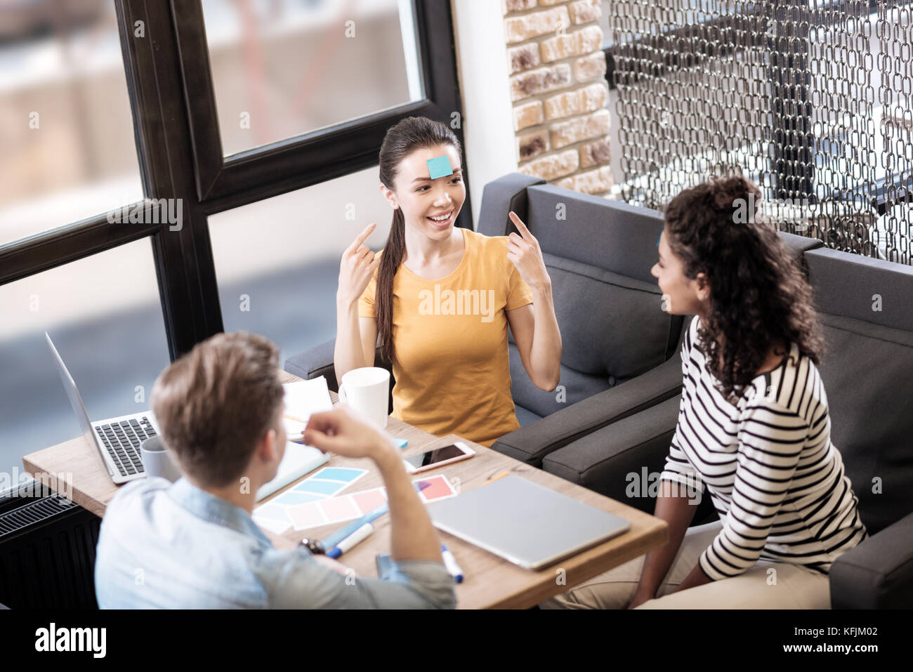 Alert girl playing a game with her friends Stock Photo - Alamy