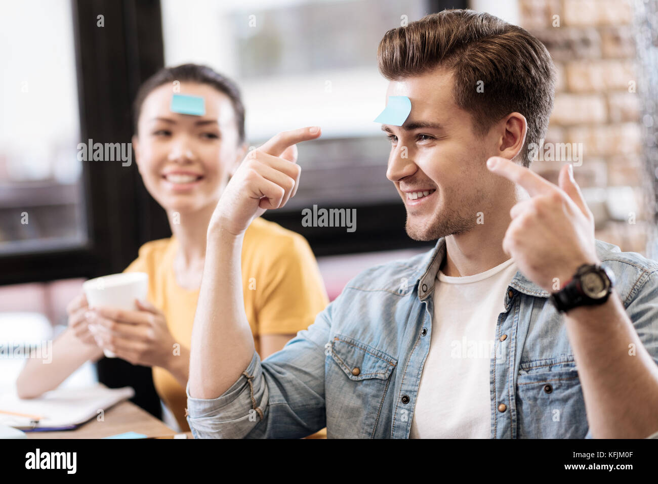 Alert man playing a game with his friends Stock Photo - Alamy
