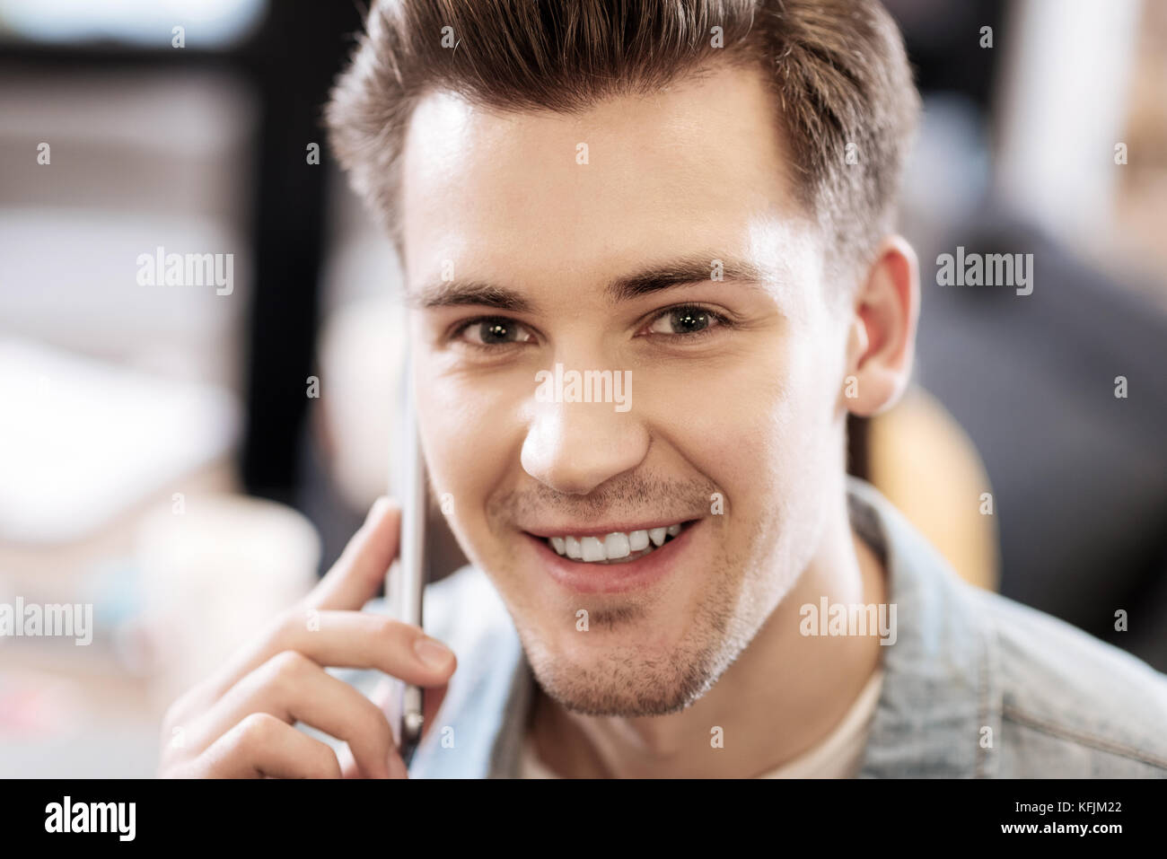 Happy man talking on the phone Stock Photo - Alamy
