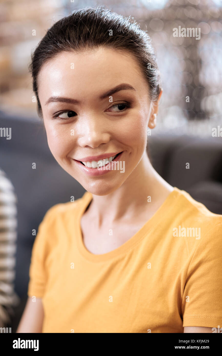Attractive happy dark-eyed girl smiling Stock Photo - Alamy