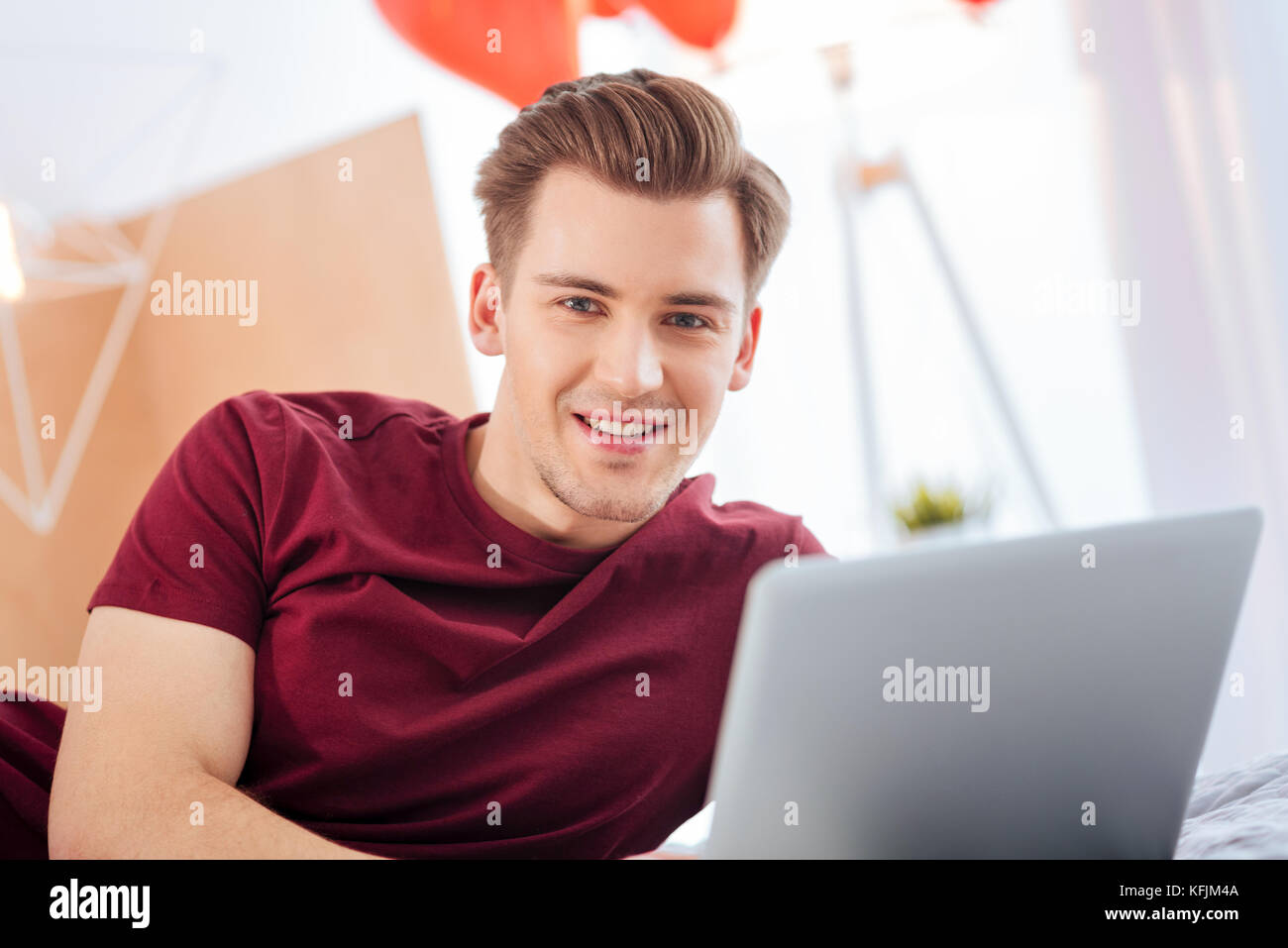 Handsome gentleman looking into camera with cheerful smile Stock Photo ...