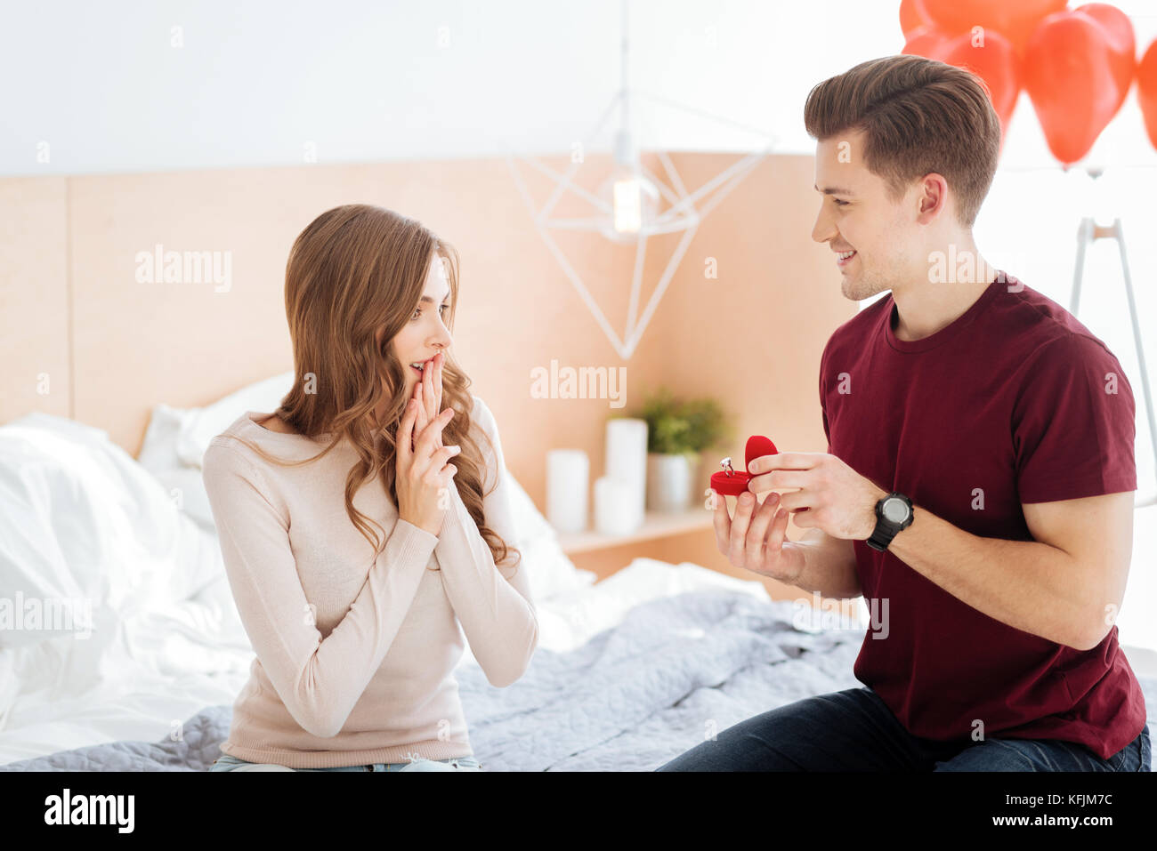 Loving boyfriend making proposal at home Stock Photo - Alamy