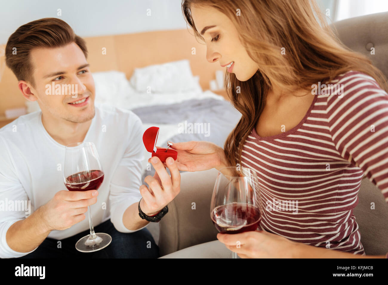 Young man smiling while making proposal Stock Photo - Alamy