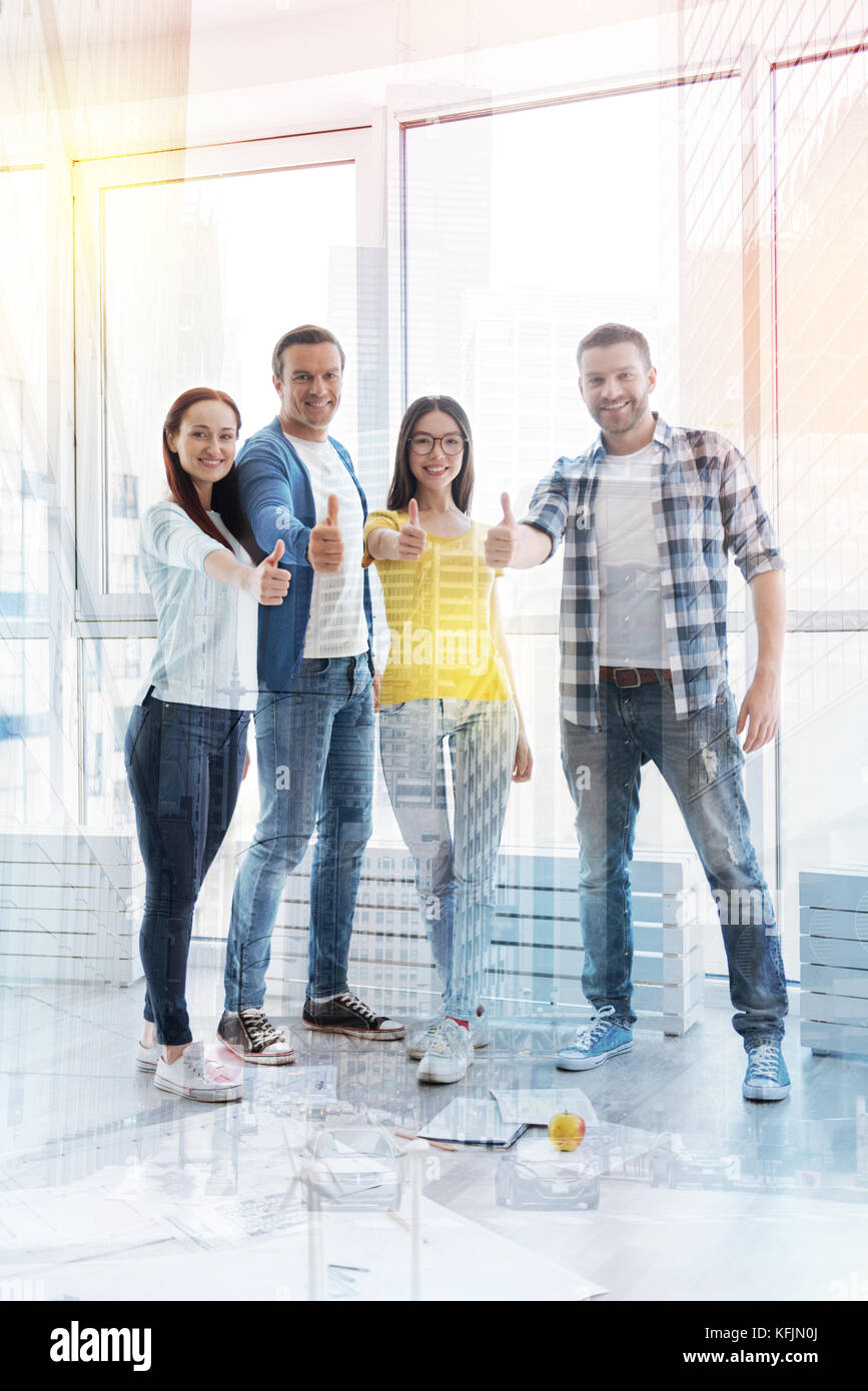 Full length photo of young colleagues Stock Photo - Alamy