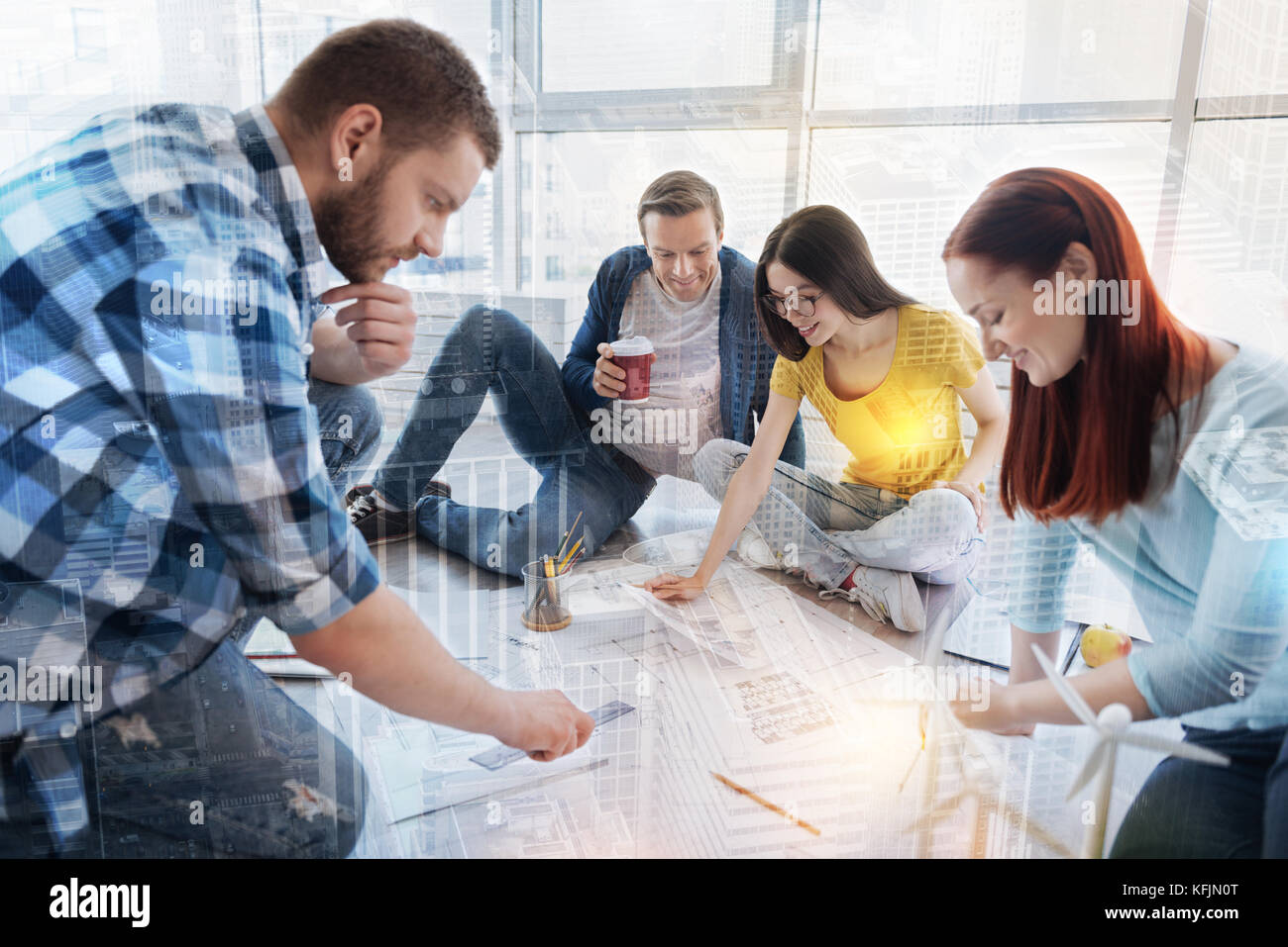 Positive team working at one project Stock Photo - Alamy