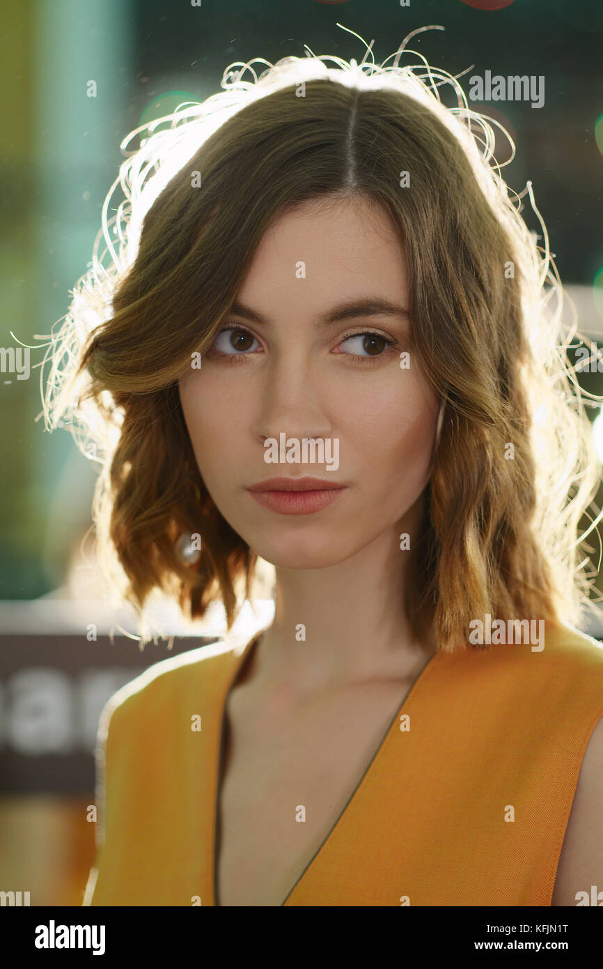 Portrait of dreamy pretty girl with natural makeup in backlight Stock ...