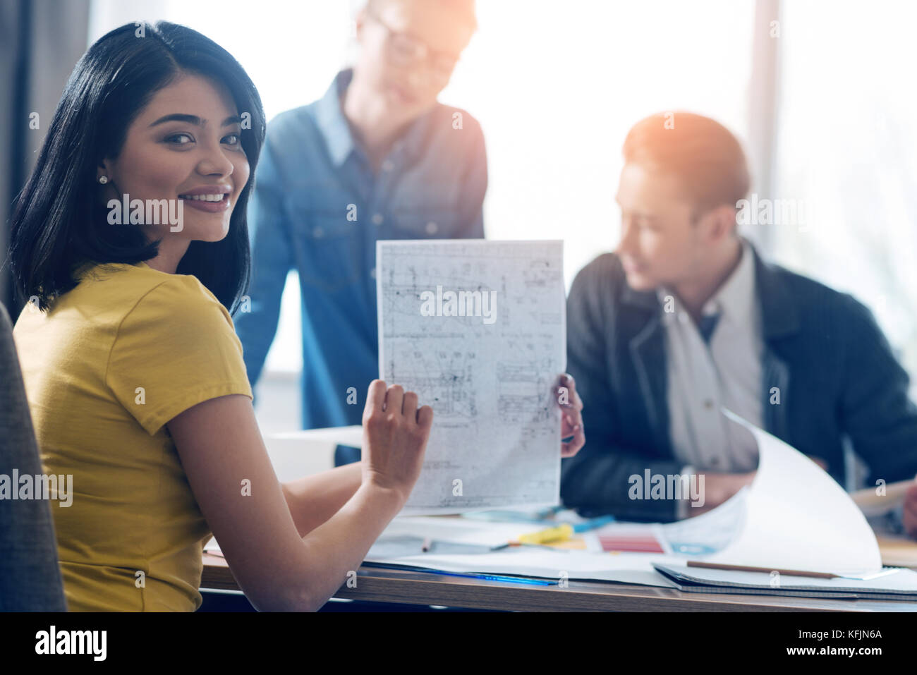 Charming female person showing her plan Stock Photo - Alamy