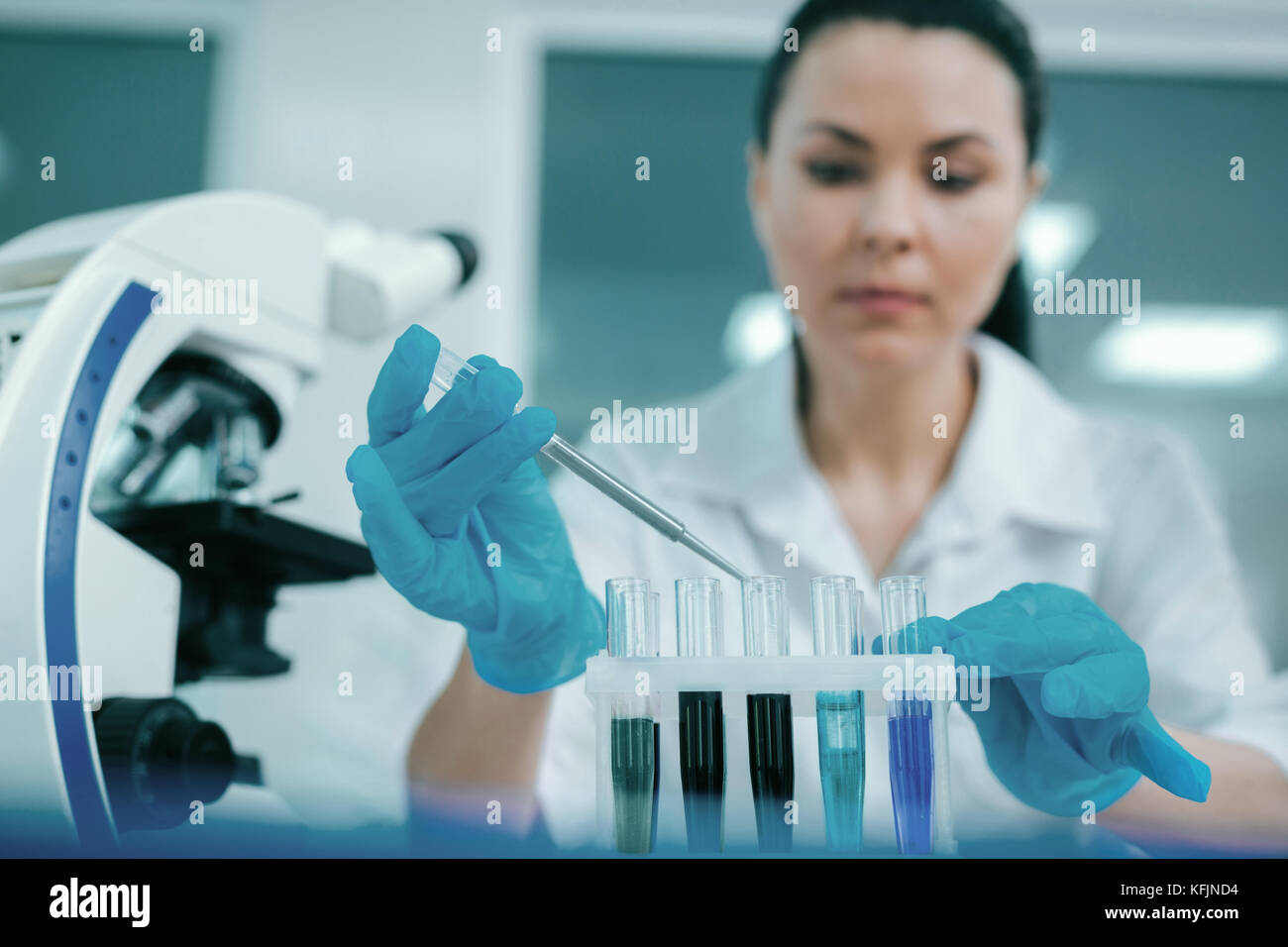 Attentive practitioner taking necessary samples Stock Photo - Alamy