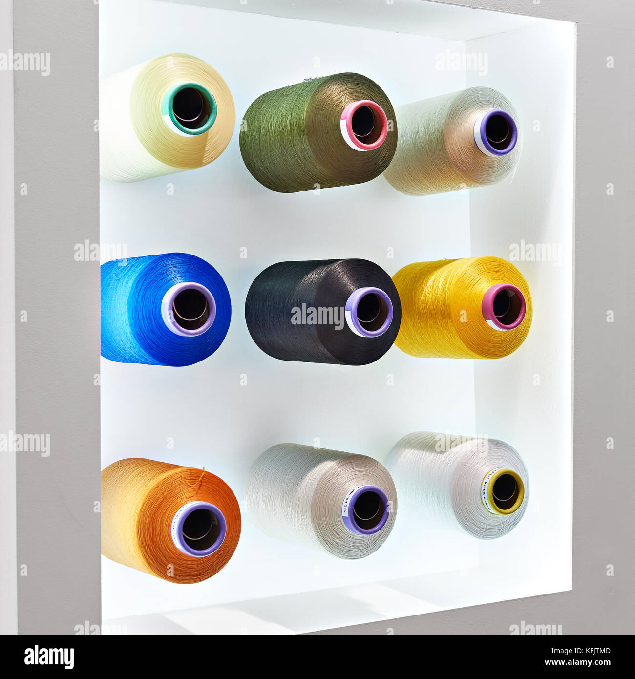 Bobbins with colored thread for industrial textile machines Stock Photo ...