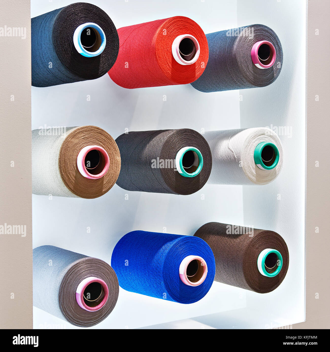 Bobbins with colored thread for industrial textile machines Stock Photo ...