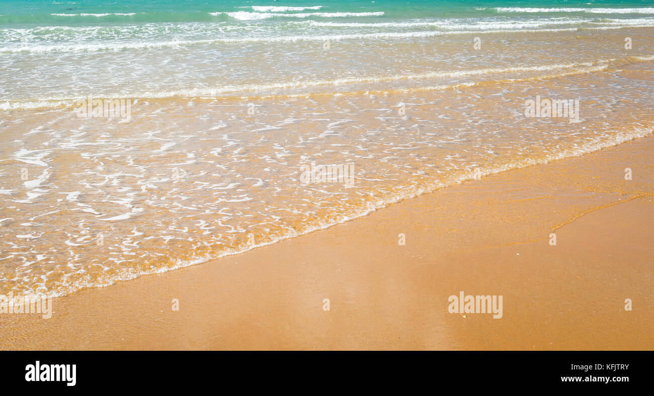 Summer sunlight on beach shoreline background Stock Photo - Alamy
