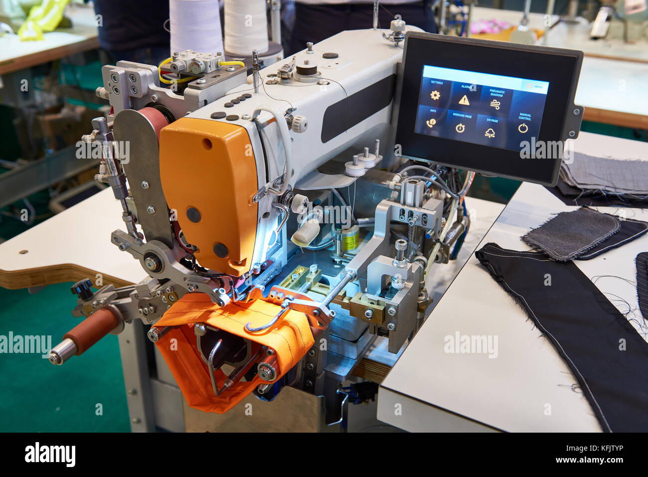 Automatic sewing bottom hemming machine in workshop Stock Photo - Alamy