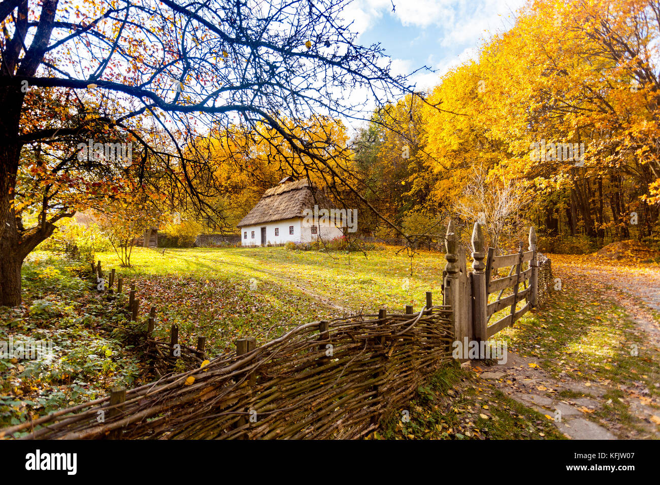Traditional old ethno house. Autumn, fall concept. Photo in forest or ...