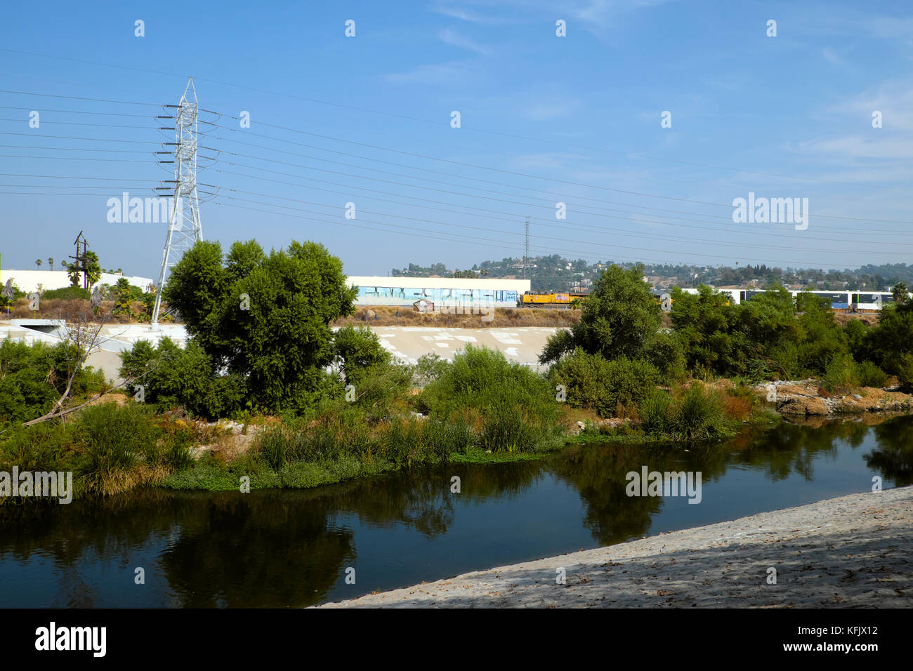 View of industrial warehouse & electricity pylons opposite Frogtown Los ...