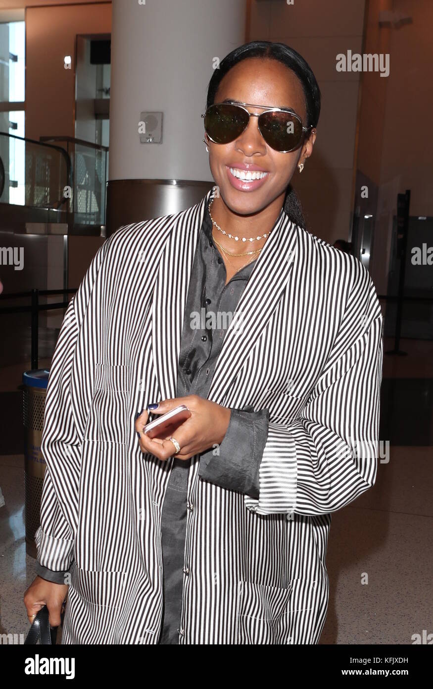 Kelly Rowland smiles for the camera at Los Angeles International ...