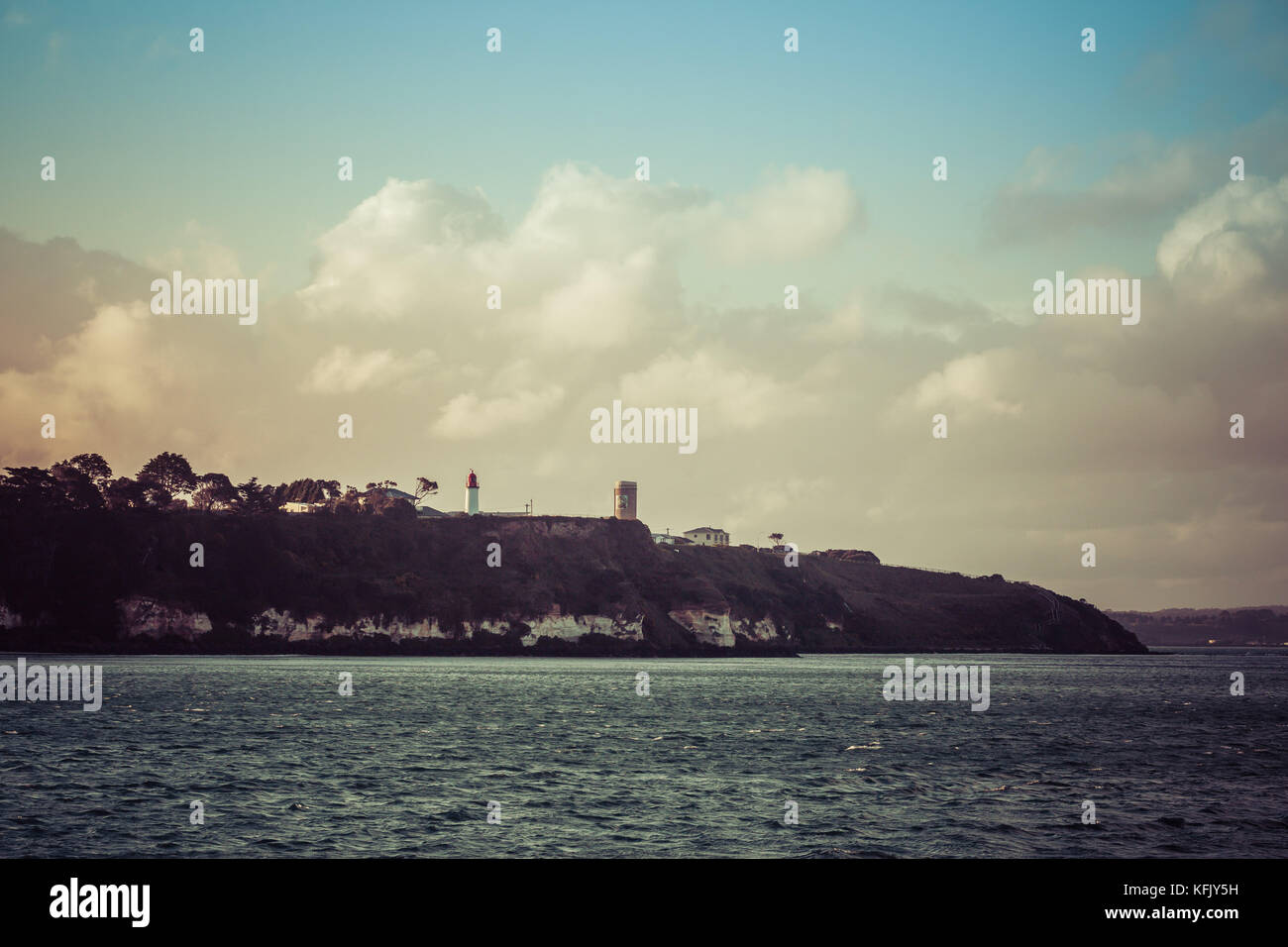 Portland Lighthouse on a cliff at sunset in Portland, Victoria ...