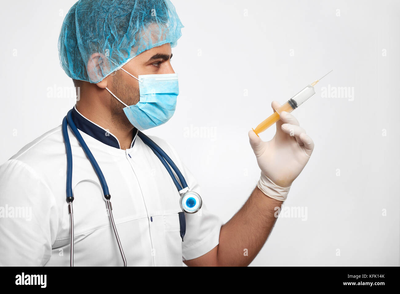 Male doctor posing at studio Stock Photo - Alamy