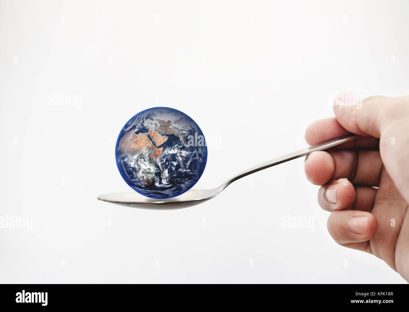 Blue planet earth on spoon, isolated on white background. Elements of ...