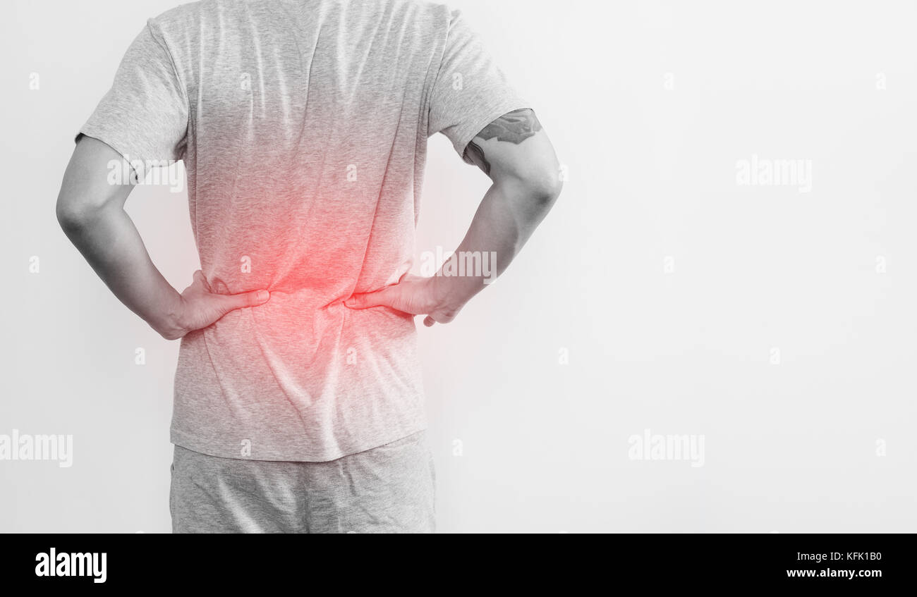 a man touching his back, with red highlight concept of back pain and ...