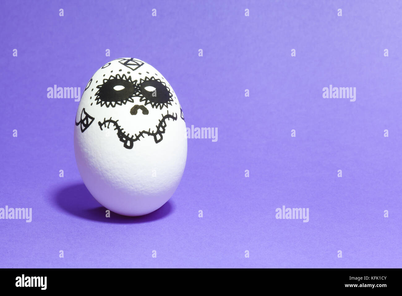 The dead eggs standing on colored background Stock Photo - Alamy