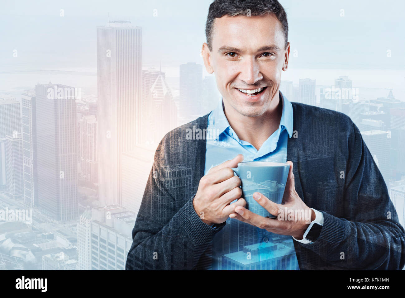 Joyful delighted man enjoying his drink Stock Photo - Alamy
