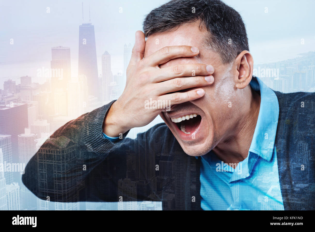 Sad angry man covering his eyes Stock Photo - Alamy