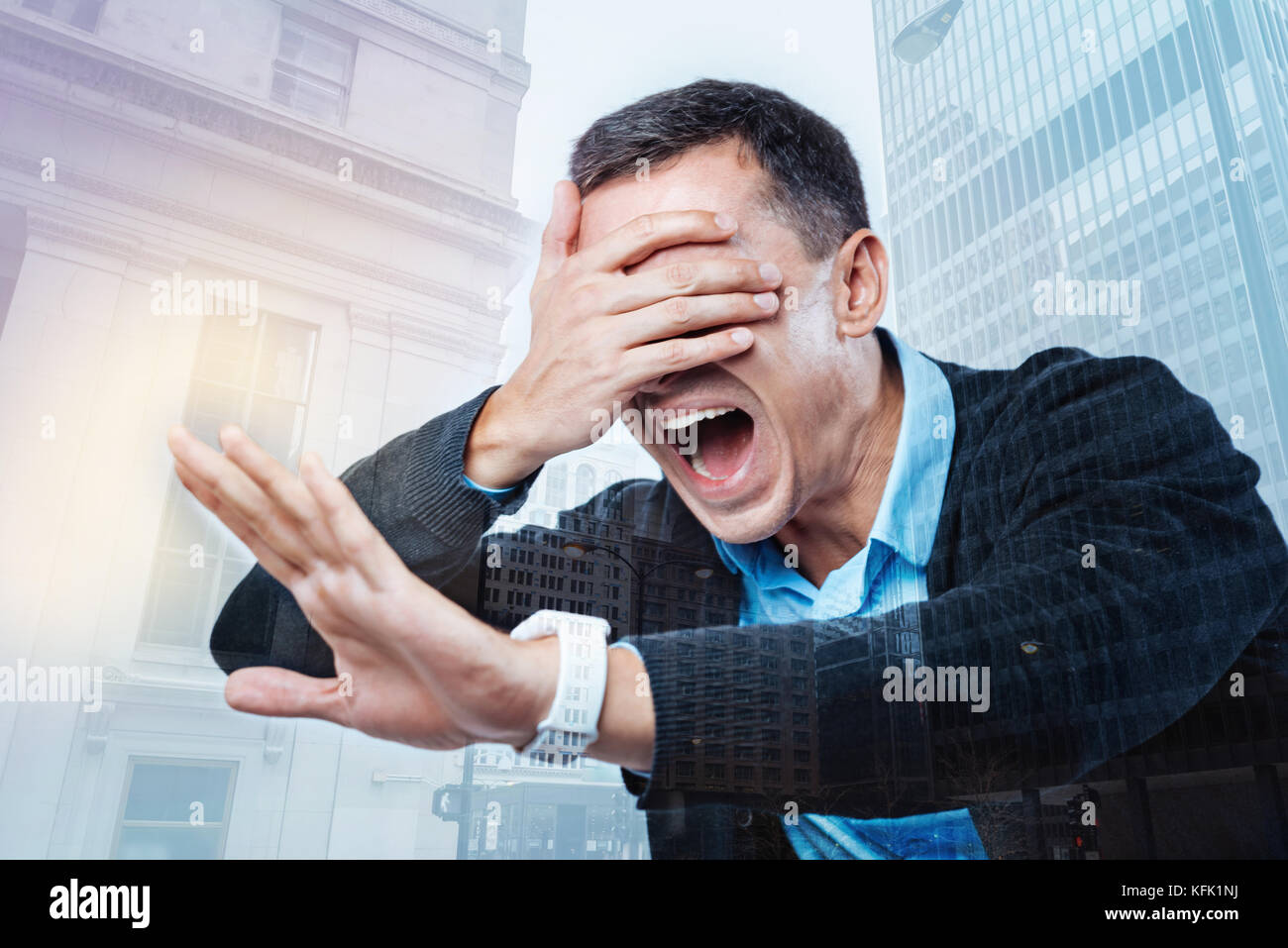 Cheerless adult man being scared Stock Photo - Alamy