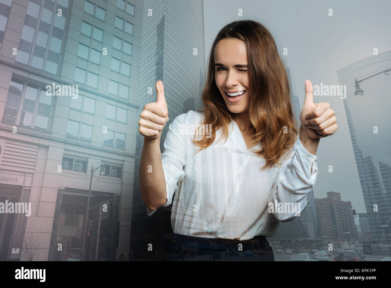 Happy positive woman winking to you Stock Photo - Alamy