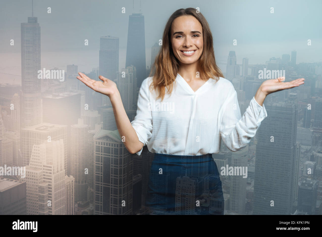 Attractive nice woman presenting a project Stock Photo - Alamy