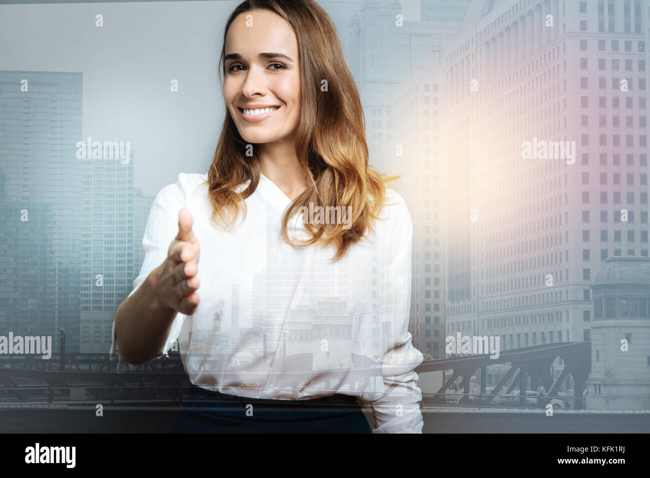 Cheerful delighted woman greeting you Stock Photo - Alamy