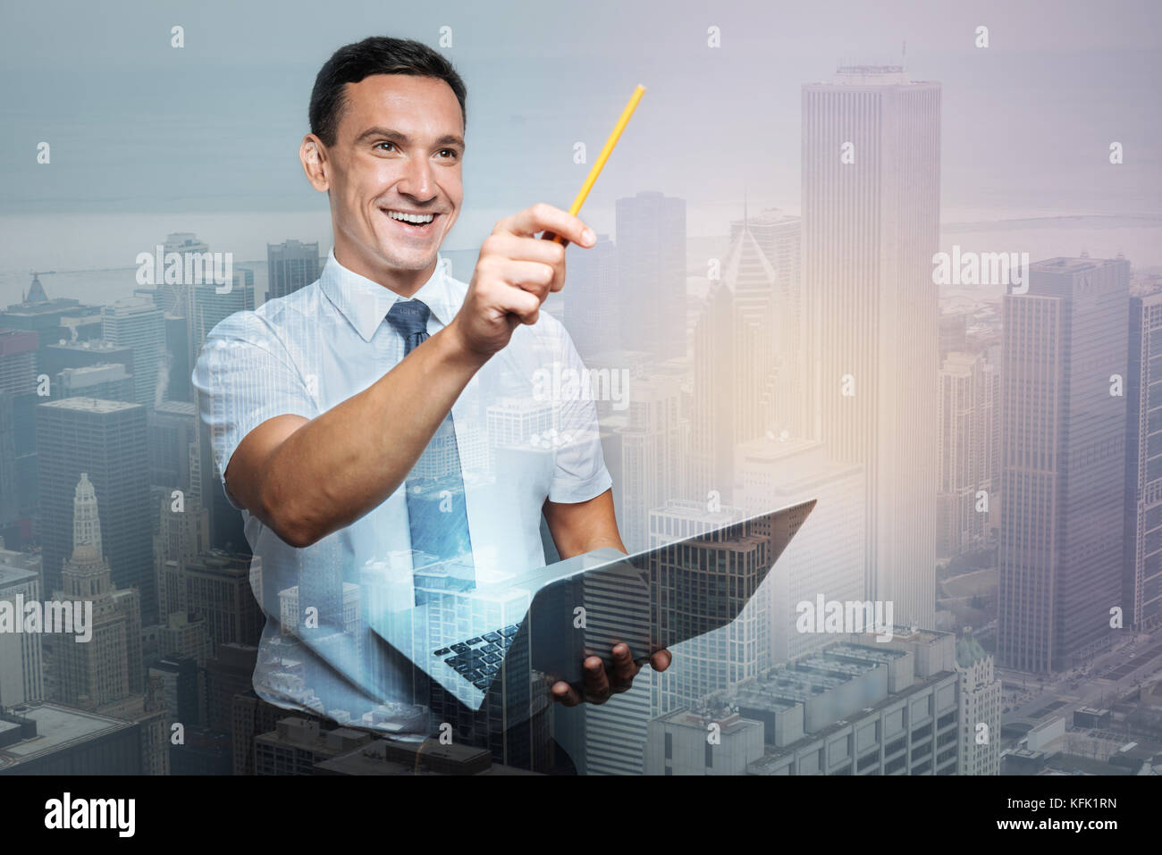 Cheerful positive office manager presenting his project Stock Photo - Alamy