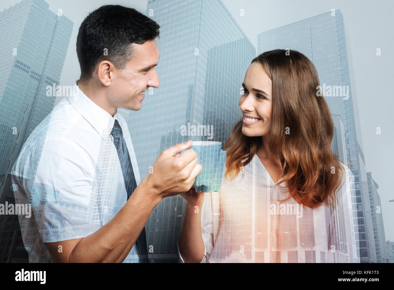 Joyful positive colleagues having tea Stock Photo - Alamy