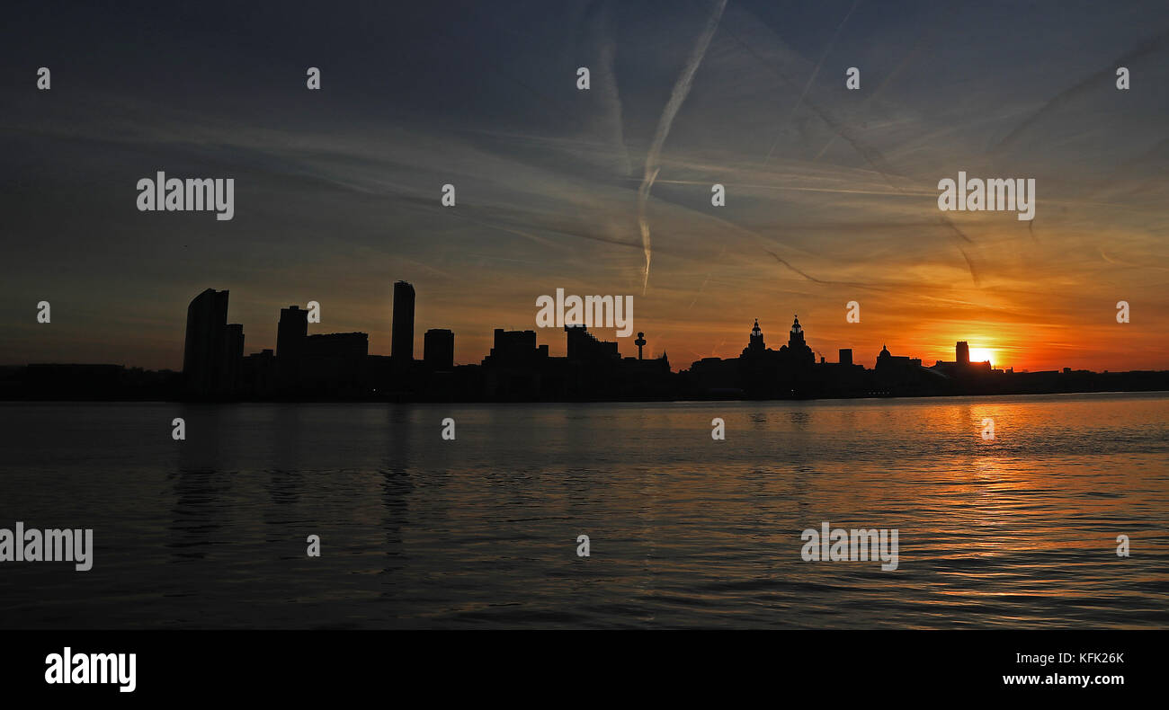 A view of the River Mersey and the city skyline as the sun rises over ...
