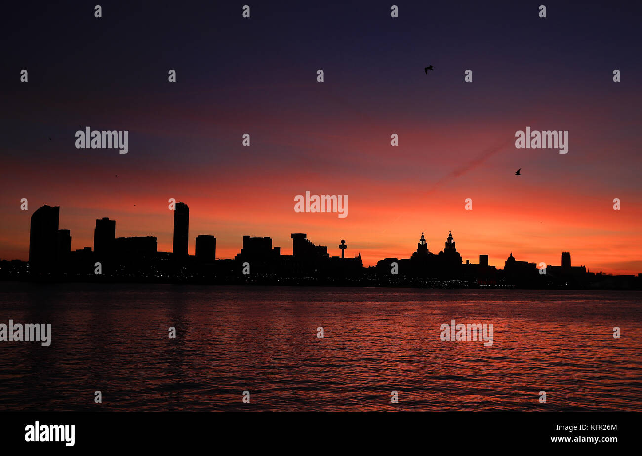 A view of the River Mersey and the city skyline as the sun rises over ...