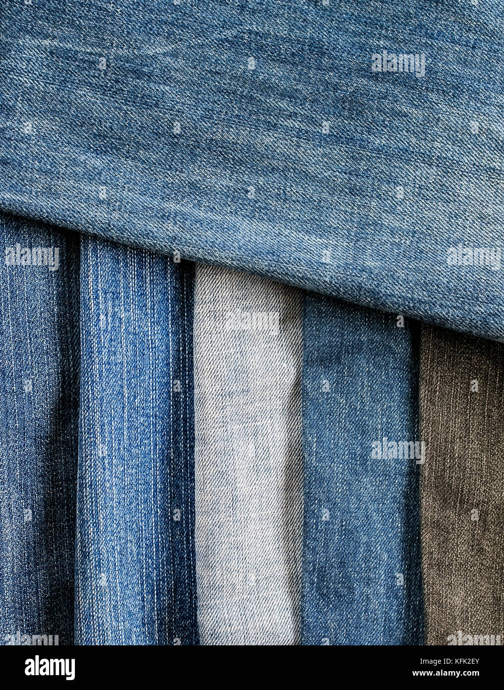 stylish textured background frame from strips of denim in different ...